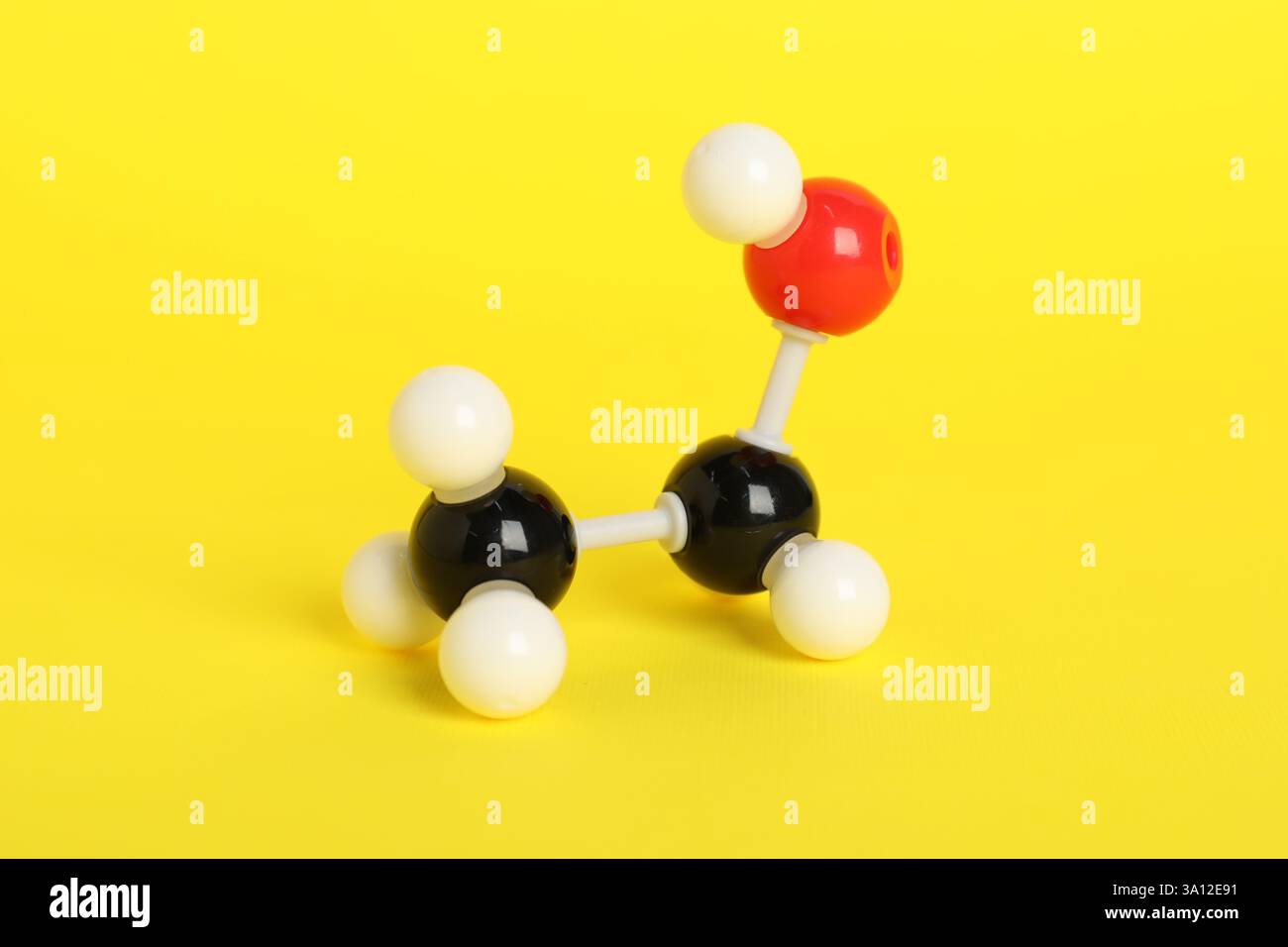 Molecule of ethanol on yellow background. Chemical model Stock Photo ...