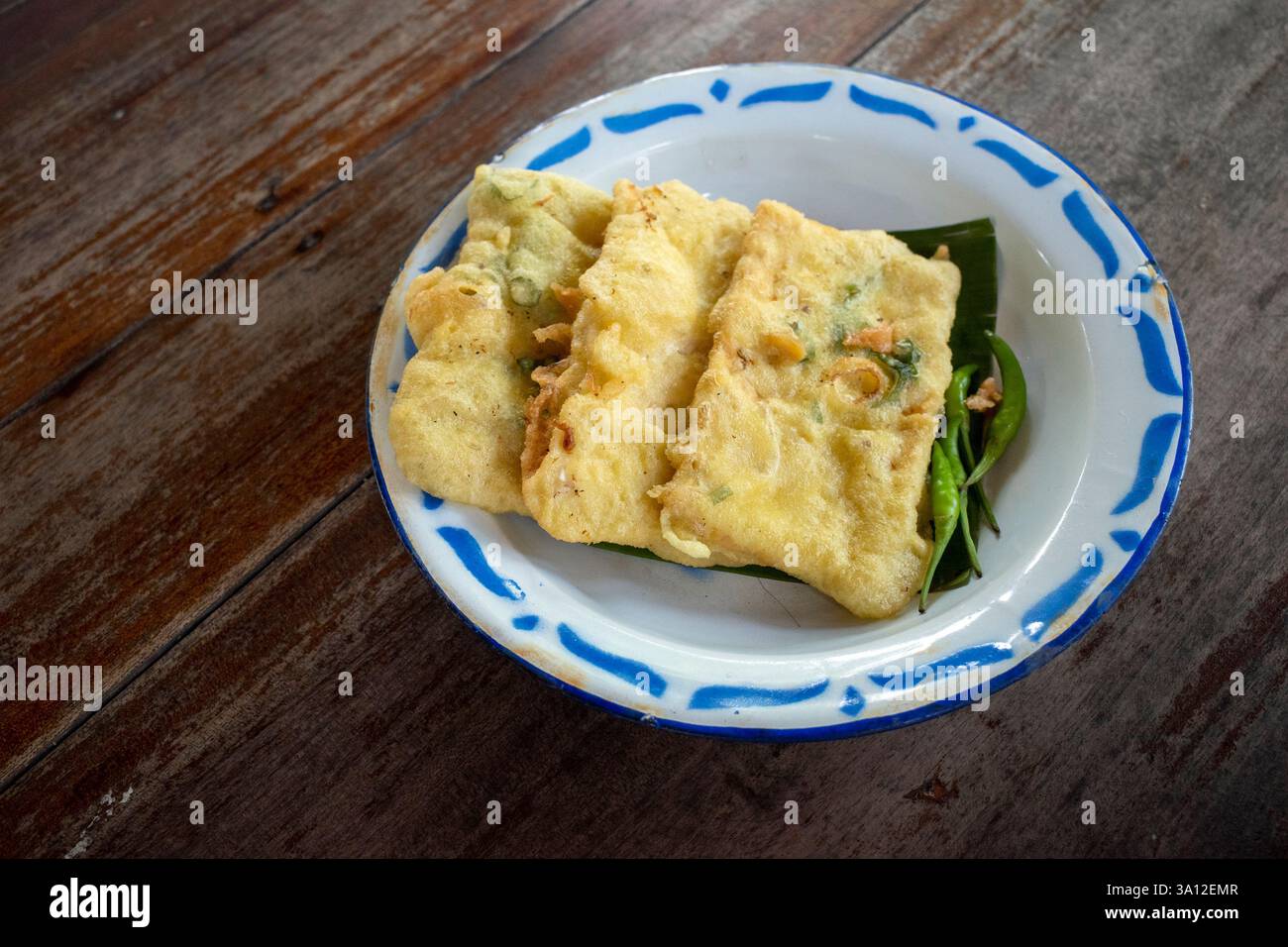 Close up of Tempe Mendoan (fried soybean cake), on a classic plate ...
