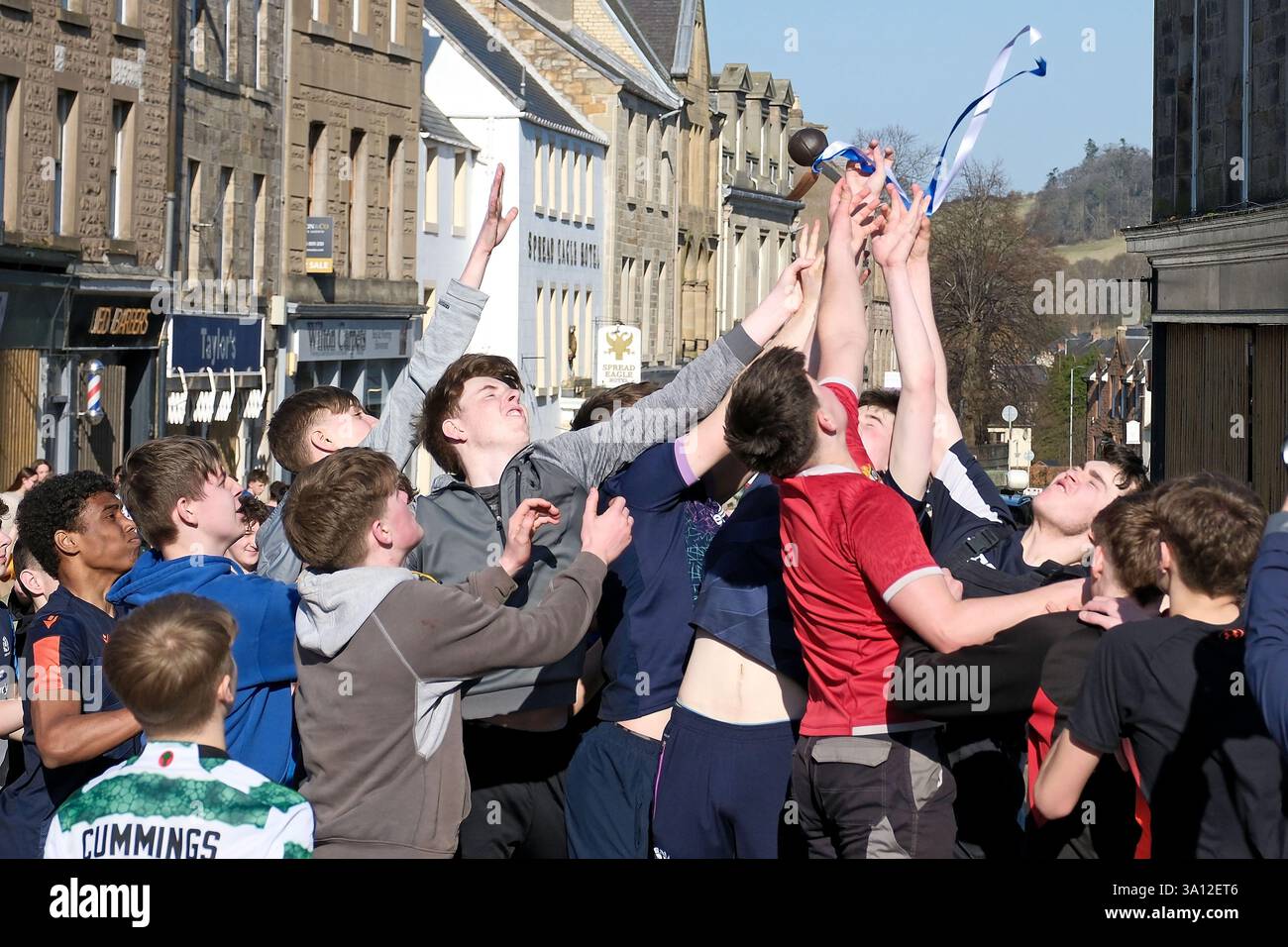 Jethart Hand Ba' Youths chase after the leather ball during the annual ...