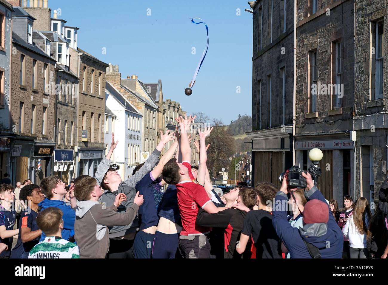 Jethart Hand Ba' Youths chase after the leather ball during the annual ...