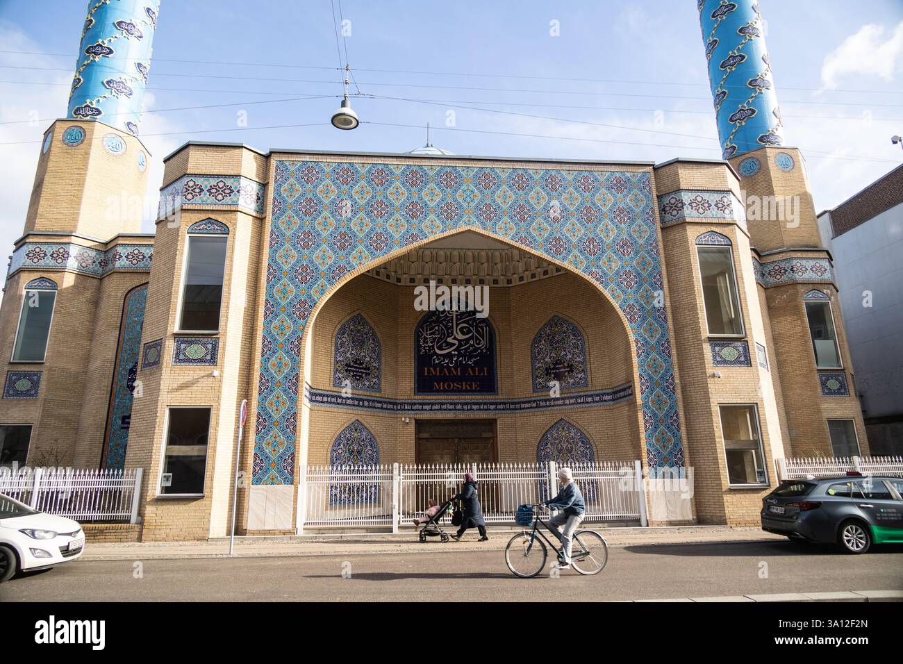 Copenhagen, Denmark. 03rd Mar, 2025. A cyclist and a stroller pass by ...