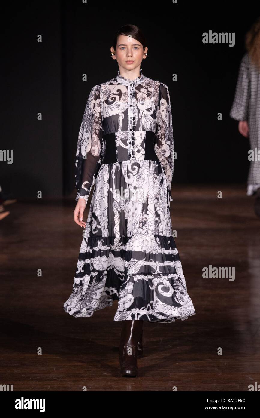 Milan, Italy. 24 Feb, 2025. A model walks the runway during the ...