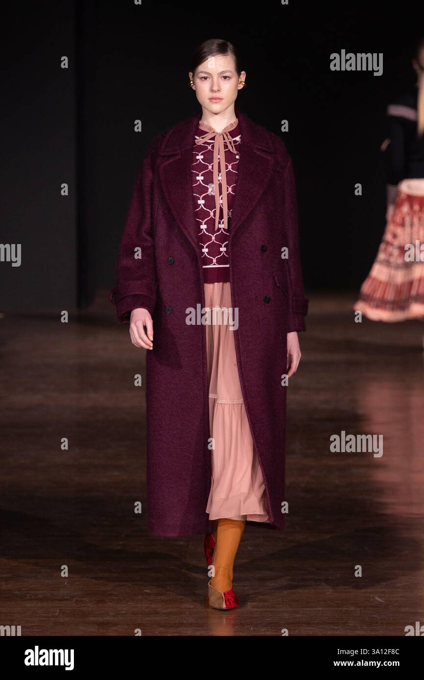 Milan, Italy. 24 Feb, 2025. A model walks the runway during the ...