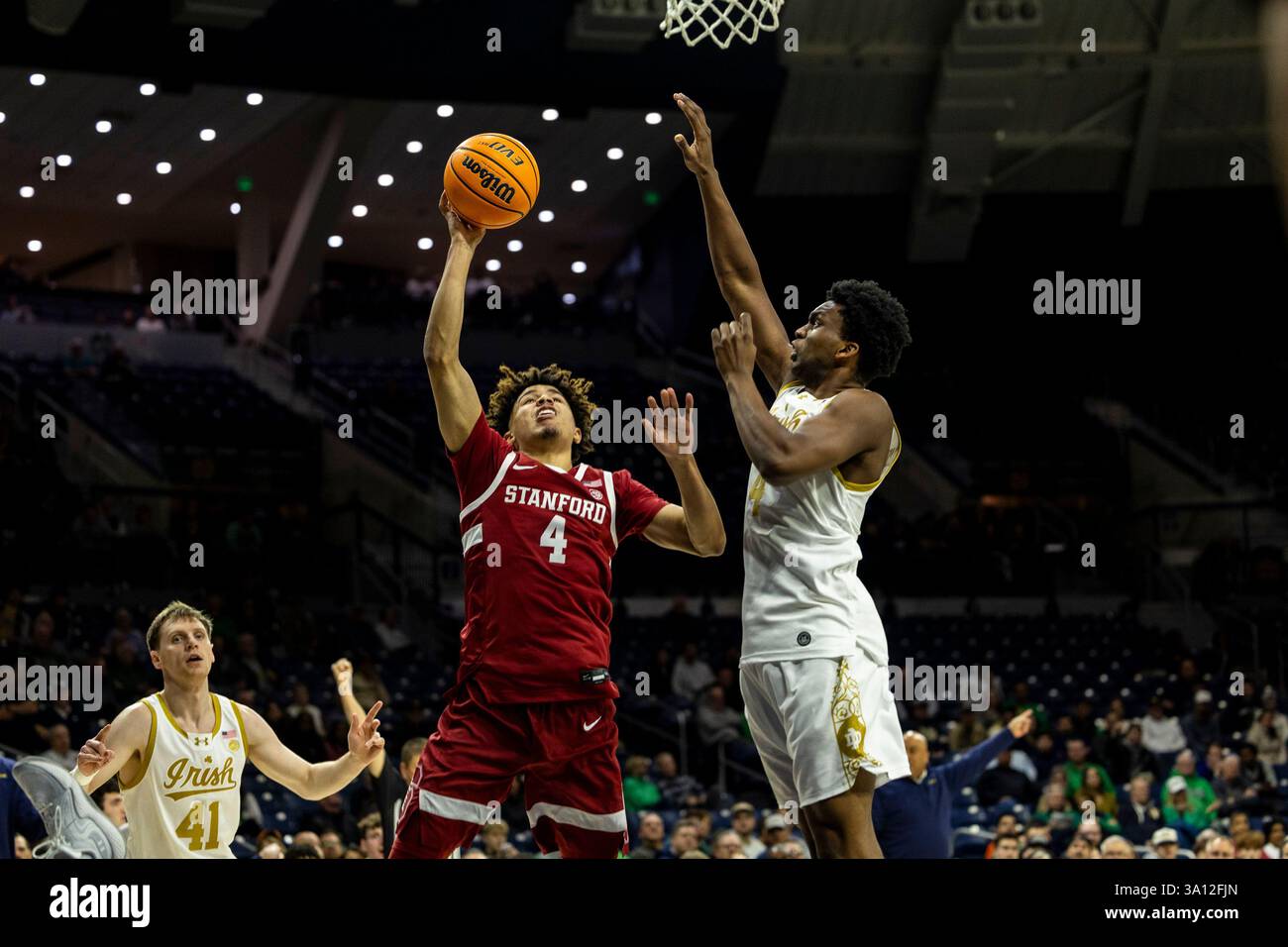 March 05, 2025: Stanford guard Oziyah Sellers (4) shoots the ball as Notre Dame guard Sir ...