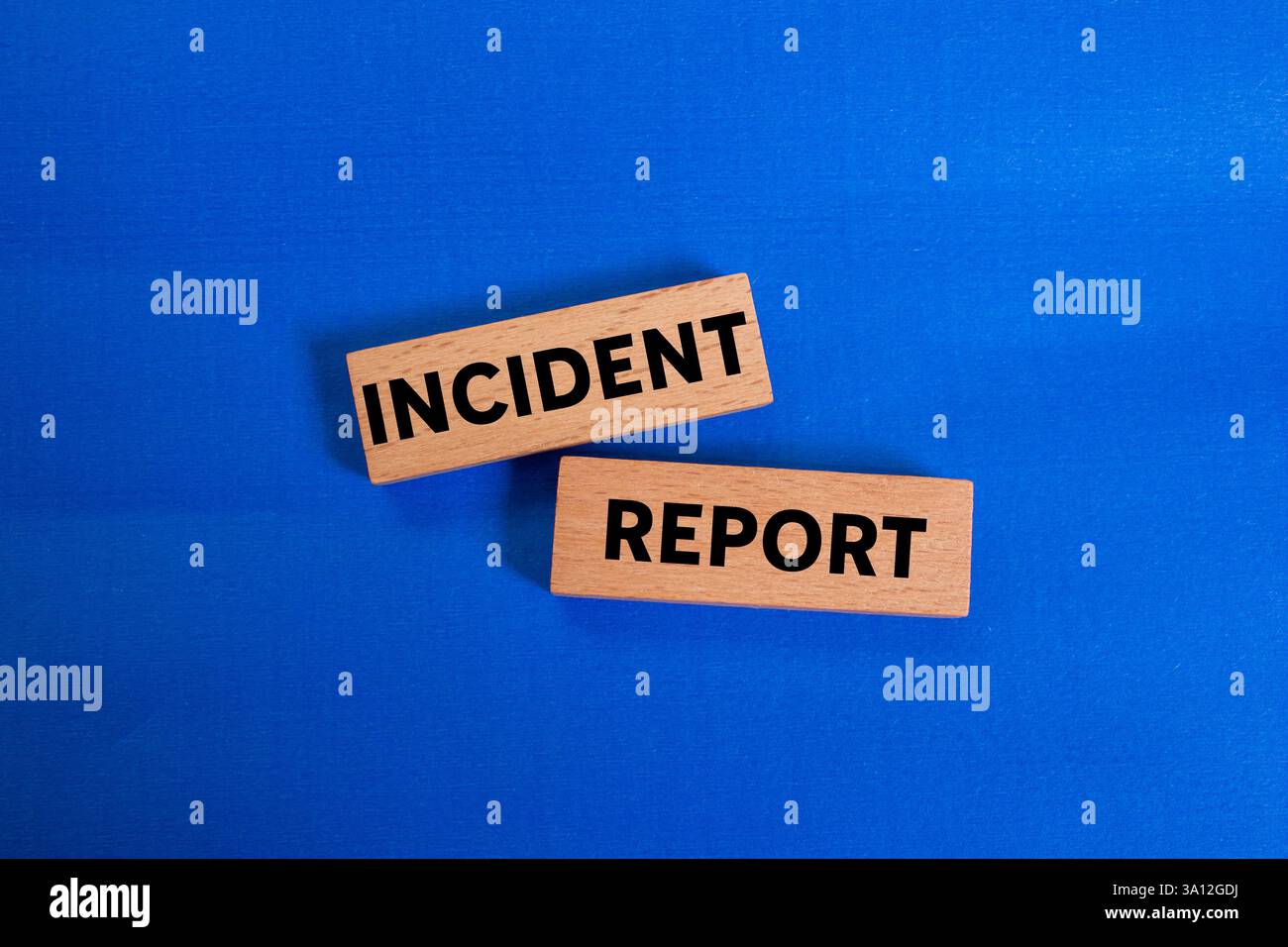 Incident report message written on wooden blocks on blue background ...