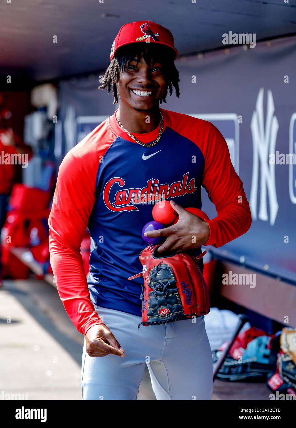 St Louis Cardinals pitcher Tink Hence in the dugout at a baseball game ...