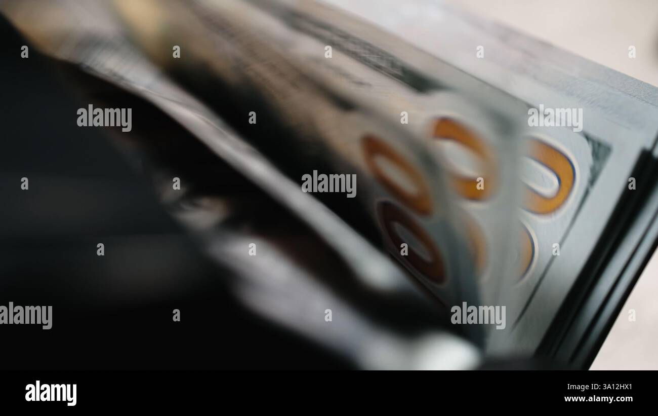 Automatic money counting machine sorts 100 dollar bills with an image ...