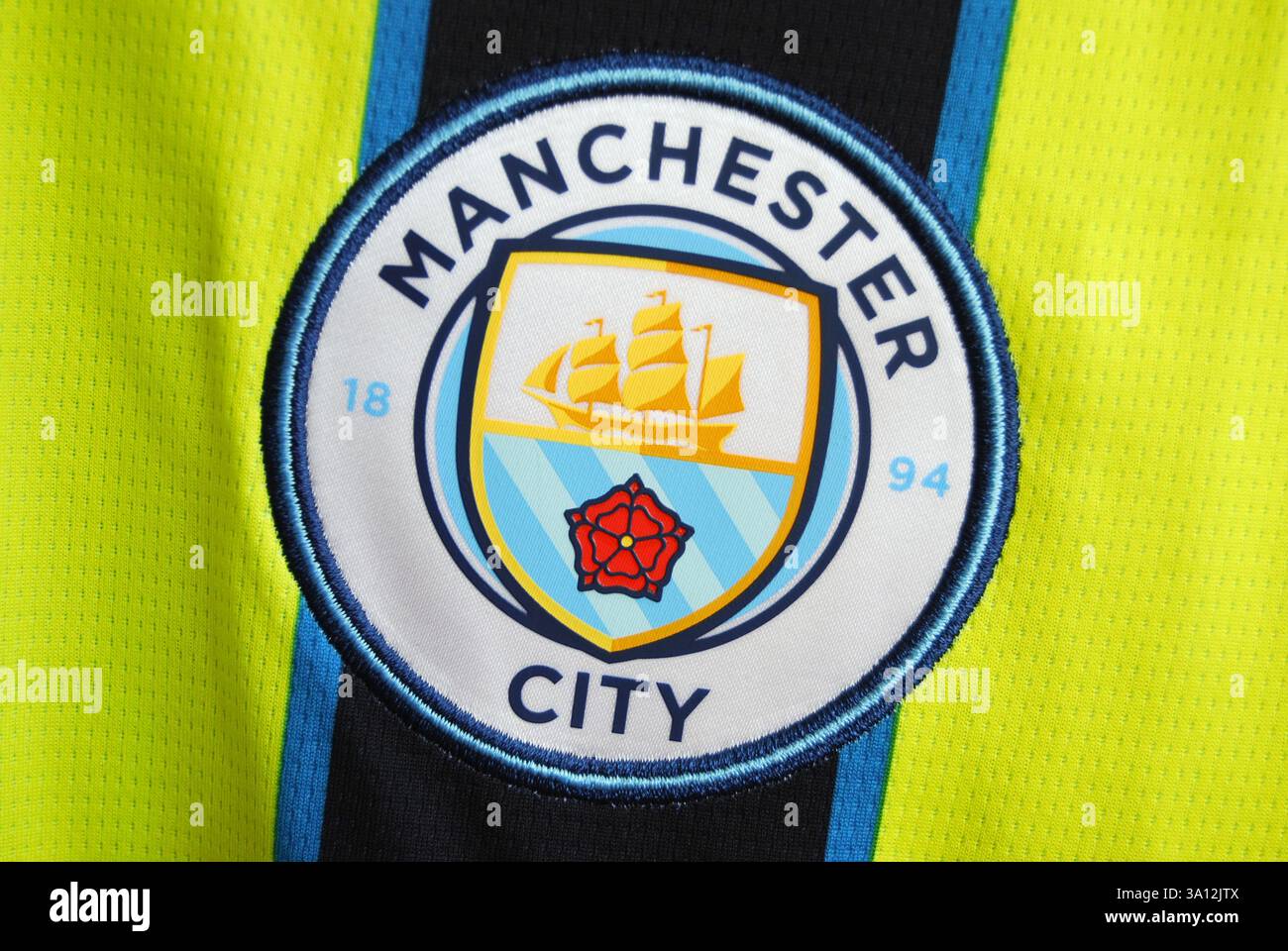 Close up photo of Manchester City FC club badge on the away shirt Stock ...