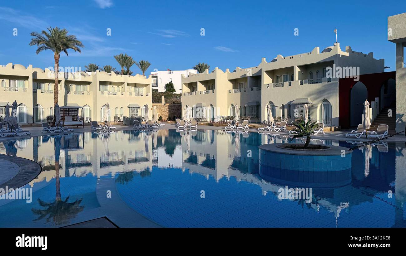 Beautiful empty swimming pool area in luxury resort town, Egypt. Wide ...