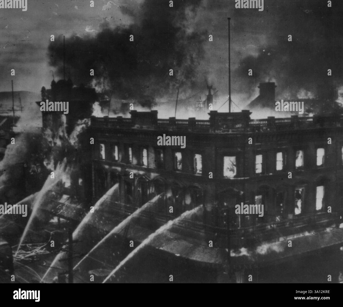 Department Store Swept By Fire -- Firemen pour streams of water into ...