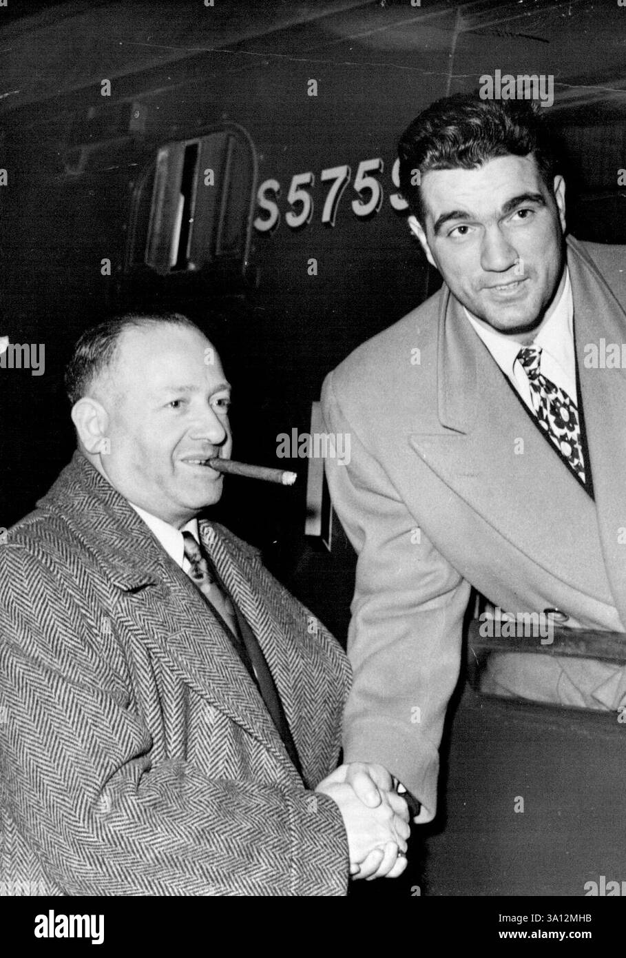 Joey Maxim Arrives For World Title Fight -- Joey Maxim (right) being ...