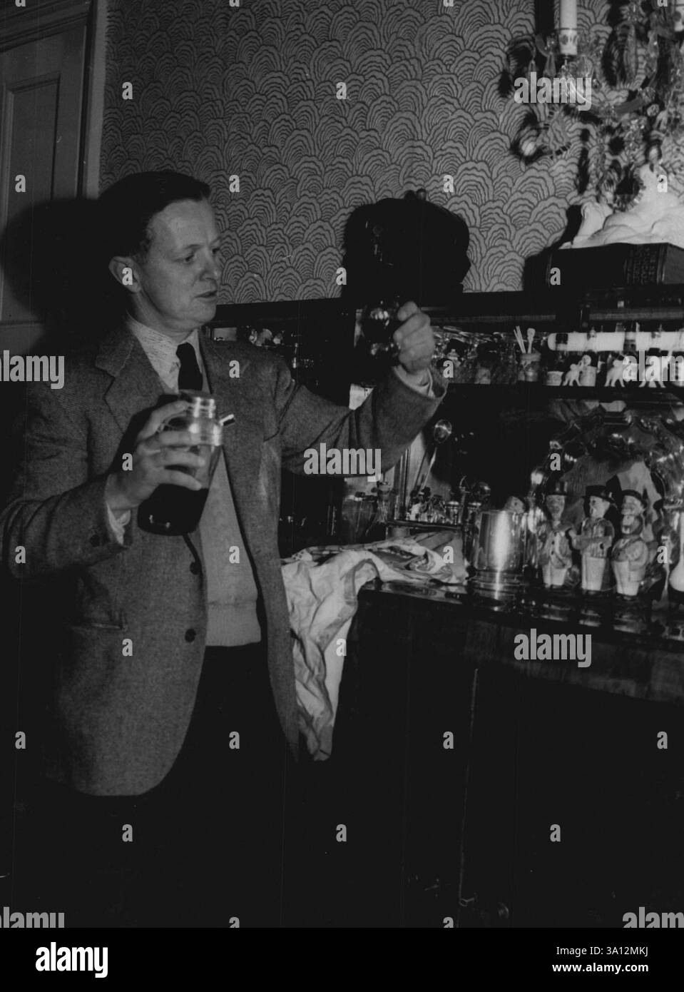 Edger Britt at his cocktail Cabinet at Bassett House. He likesdrink in ...