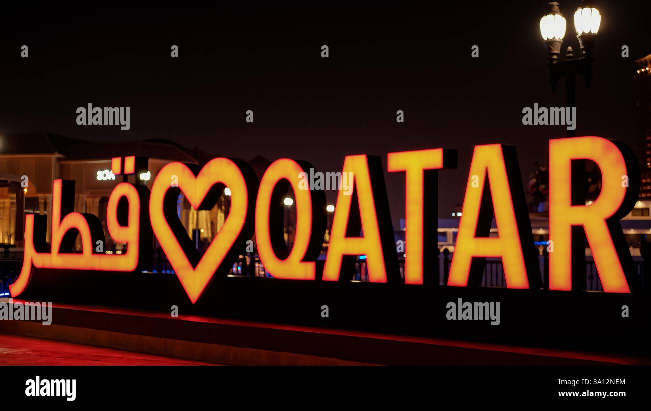Iconic I Love Qatar Sign at night, a symbol in Doha, orange neon light ...