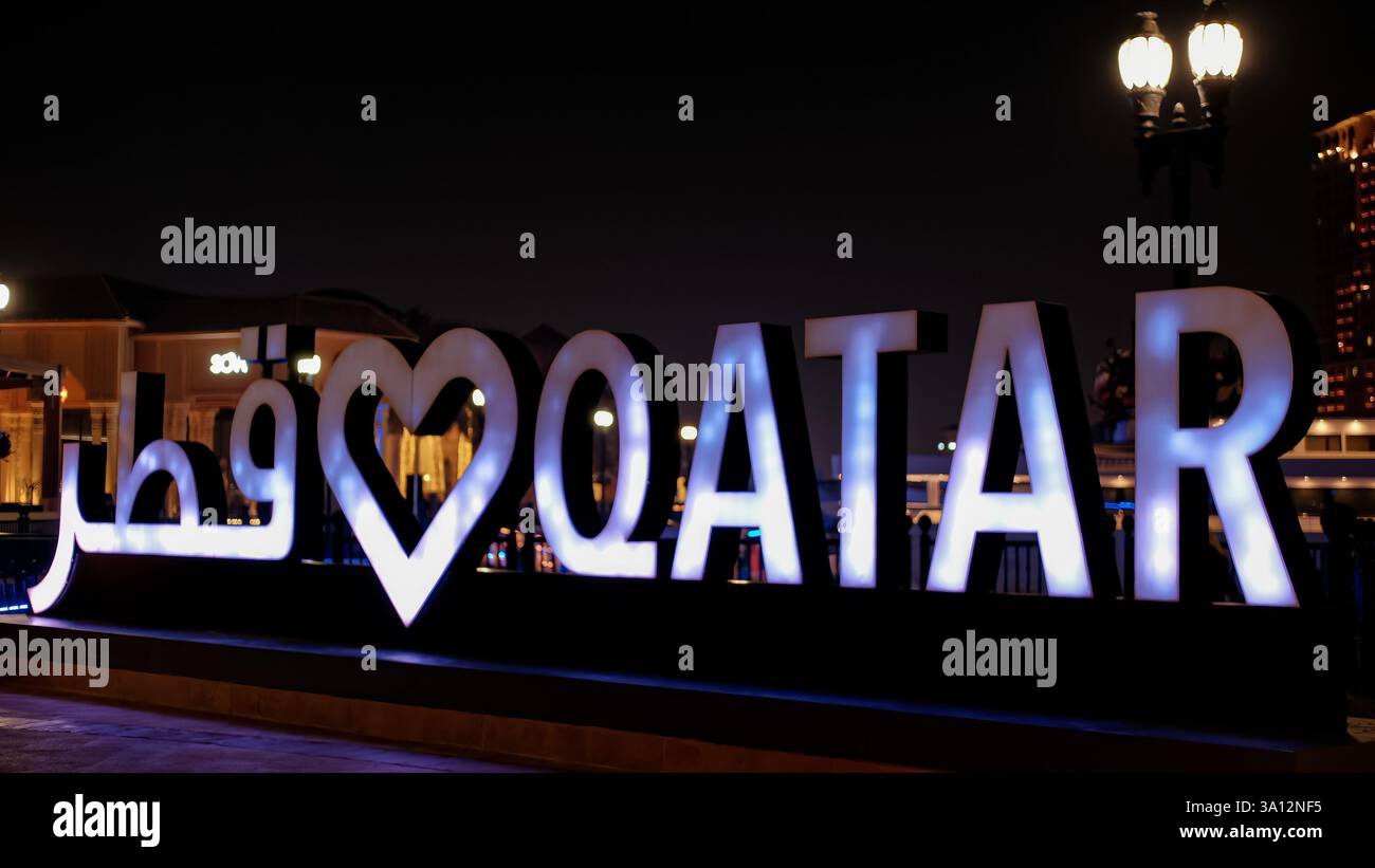 Nighttime view of the iconic I Love Qatar Sign, a symbol in Doha, blue ...