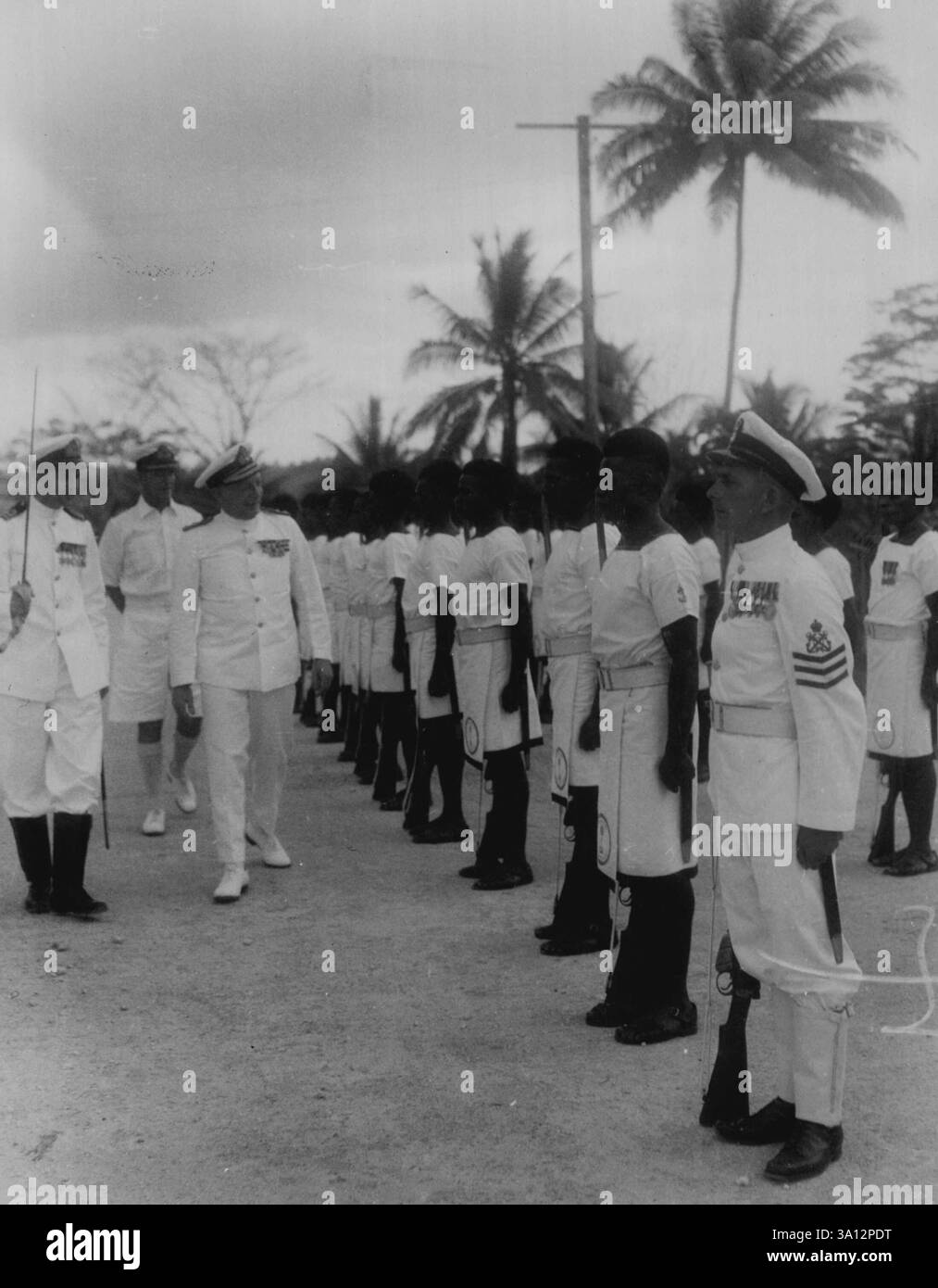 Navy-RAAF exercises. Manus Is..Vice-Admiral Sir John Collins inspecting ...
