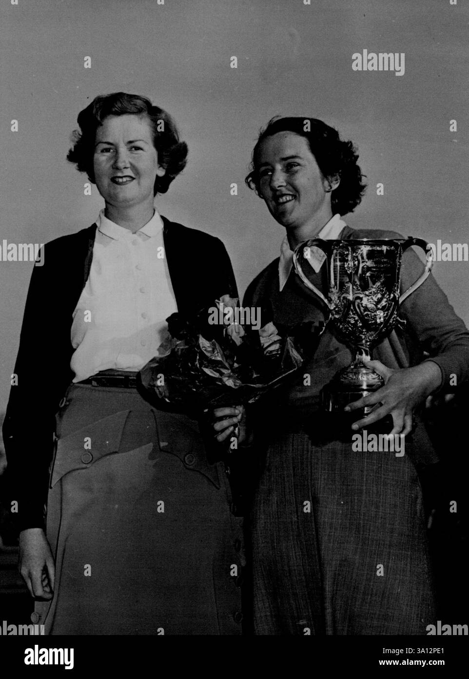 Miss Maxine Bishop (right), of Perth smiles happily as she poses with ...