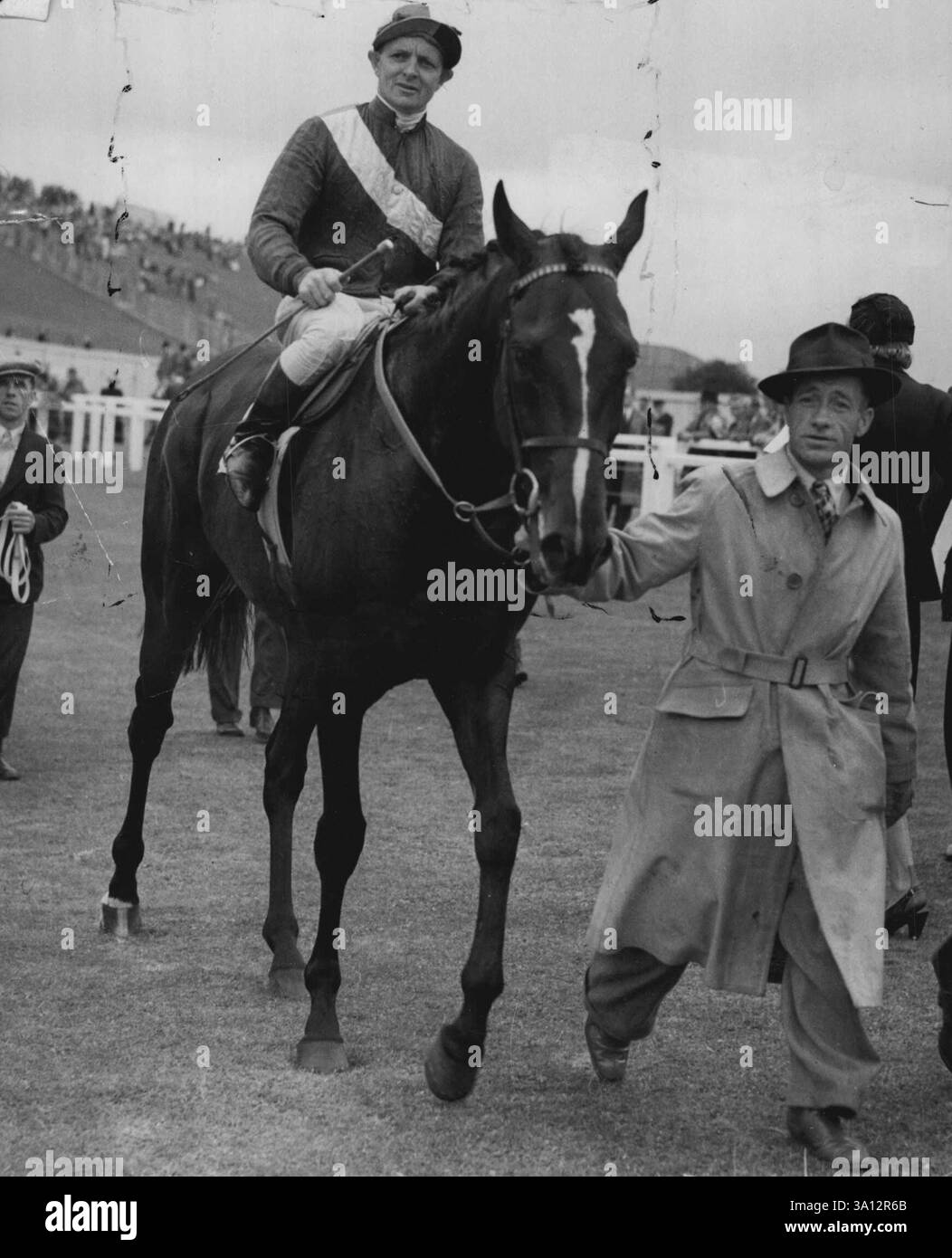 Australian Jockey Edgar Britt returns to scale after winning the ...