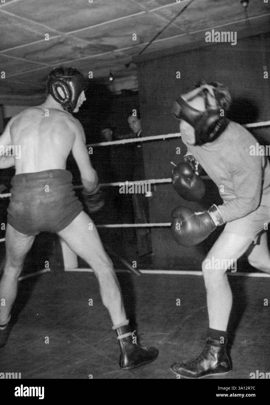 British Empire lightweight boxing champion Ron James (right) in a gymnasium workout with Tommy ...