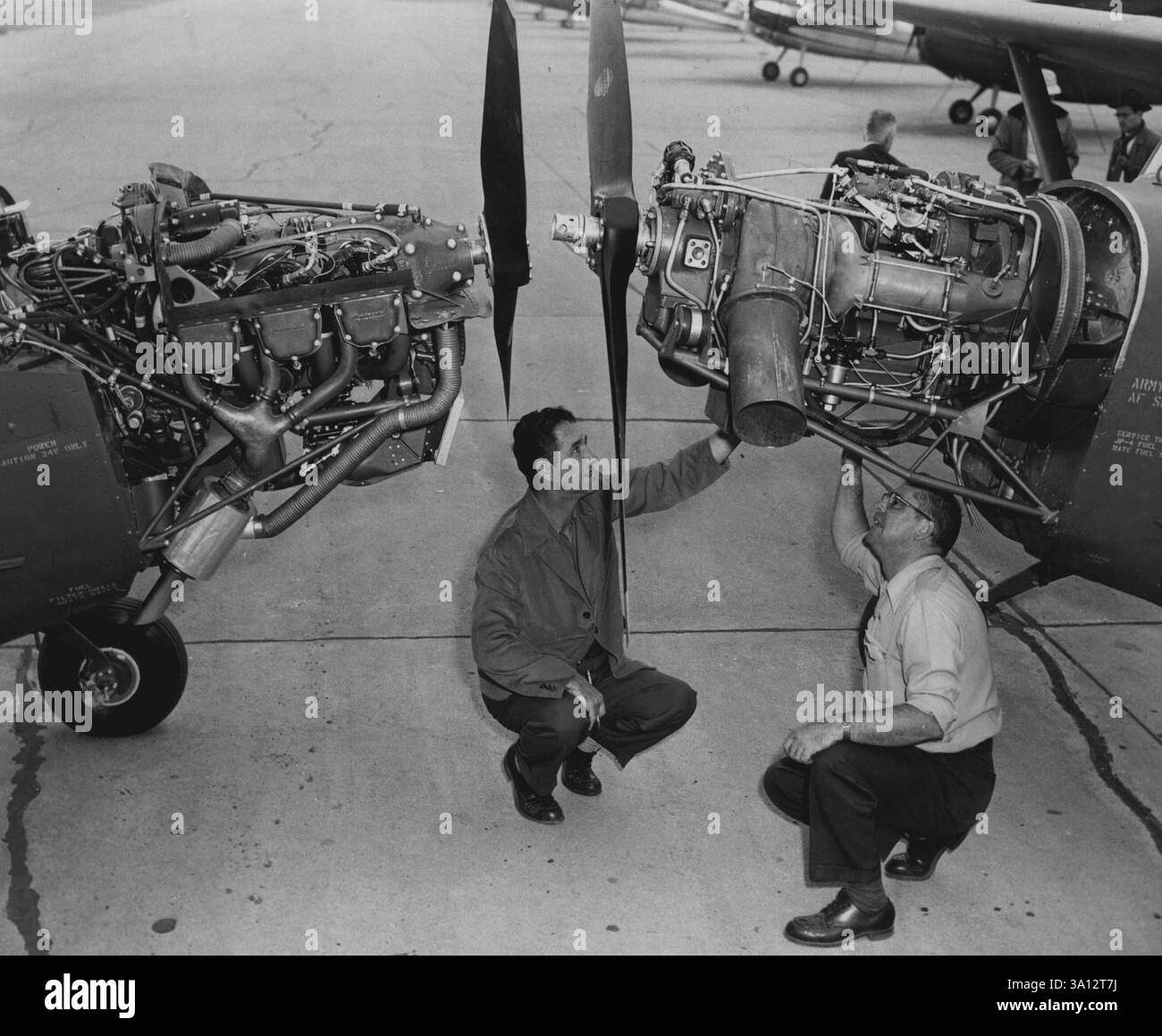 Two Cessna Aircraft Company employees pause to look over the Boeing ...
