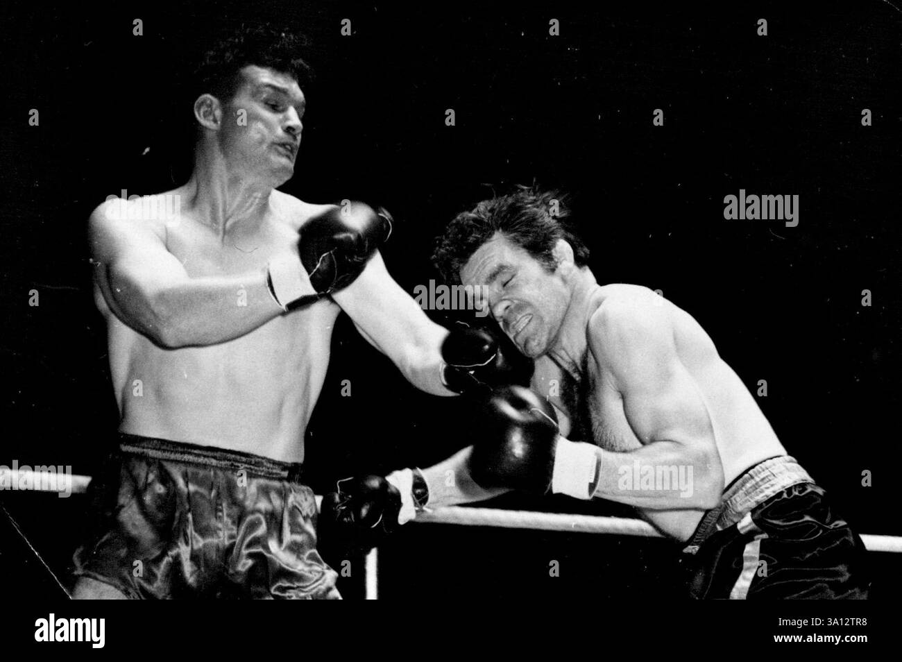 Woodcock Knocks Out Mills In The 14th Round.A fine action shot as Woodcock (left) lands a ...