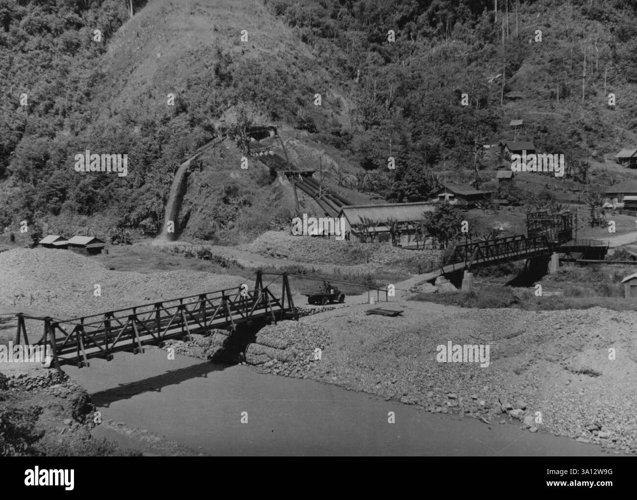 Bridge over river on Bulolo-WAU. February 17, 1942 Stock Photo - Alamy