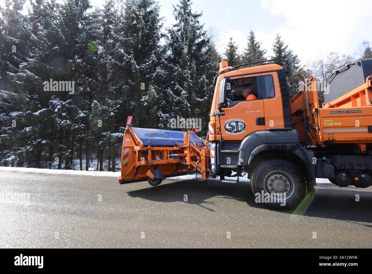 snowplow on country road, snow clearing vehicle in winter service snow ...