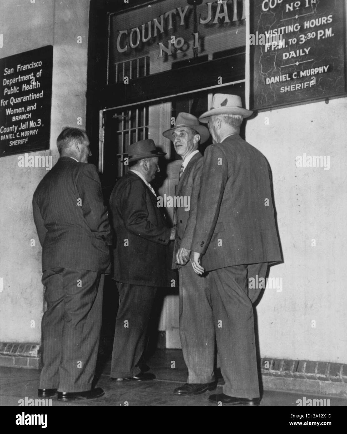 Bridges Enters Jail-- Harry Bridges (face to camera) takes a last look ...