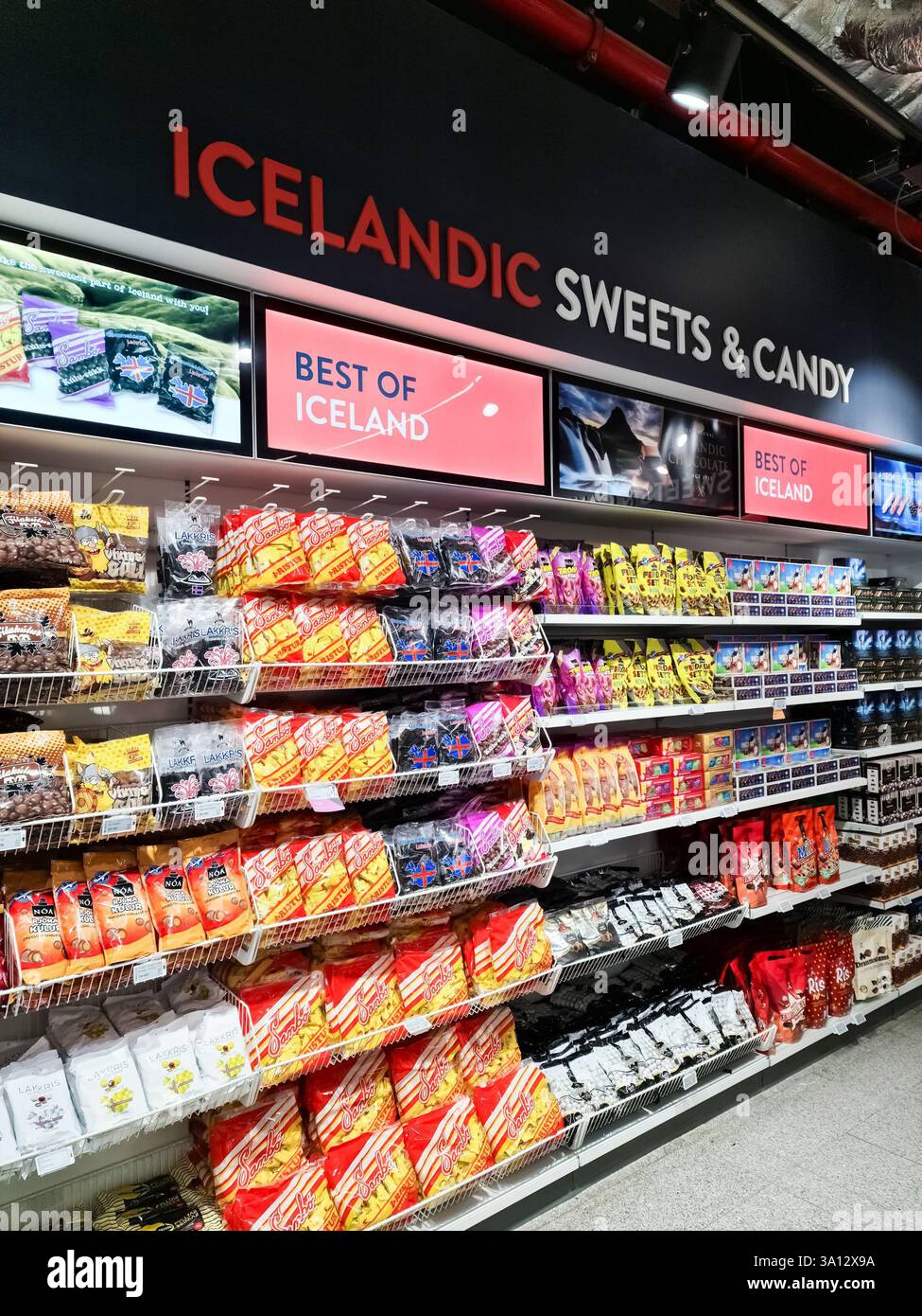 Keflavik, Iceland - 05. March 2025: Shelves full of colorful candy and ...