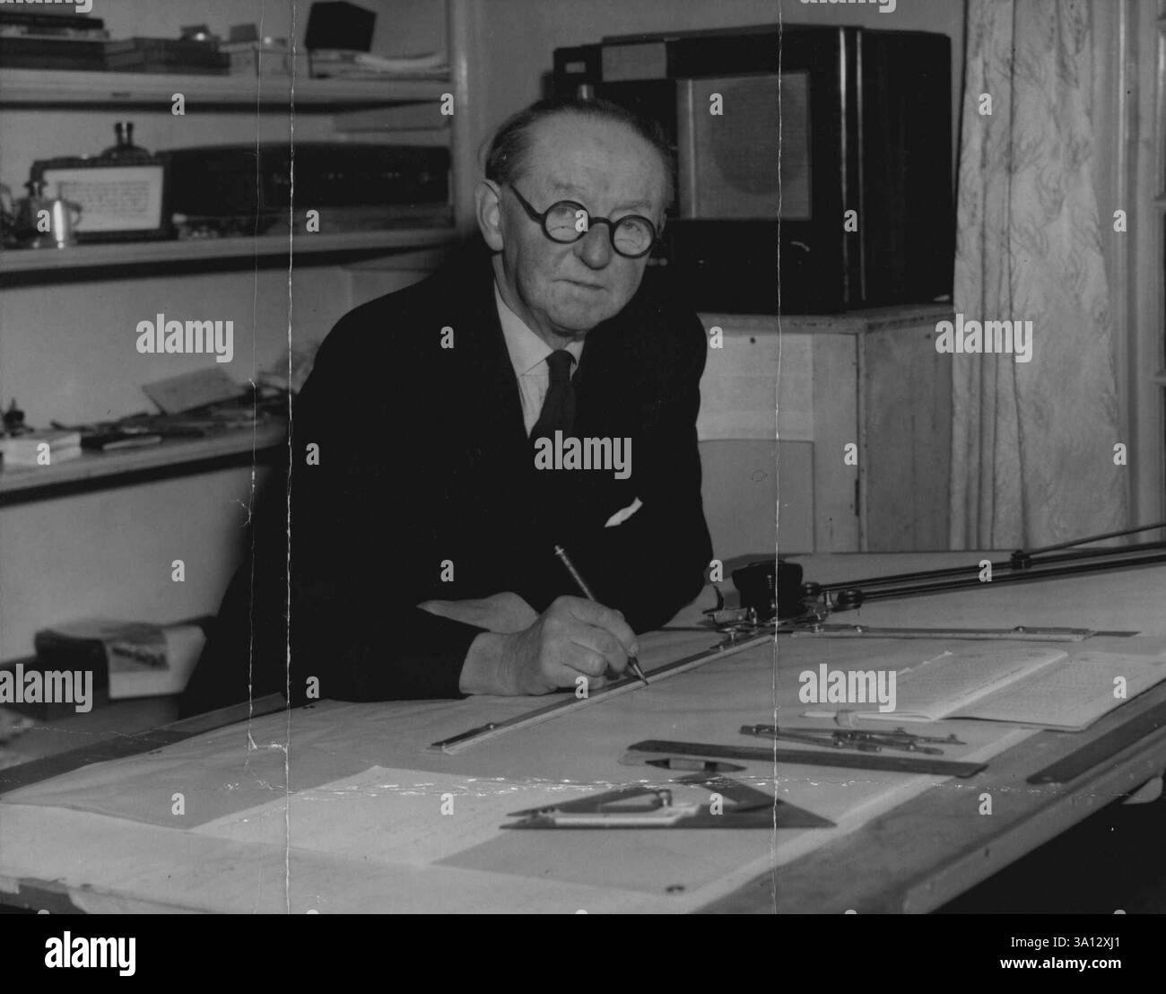 He's Invented A Wonder Engine.Photo shows: Mr.Granville Bradshaw at his ...