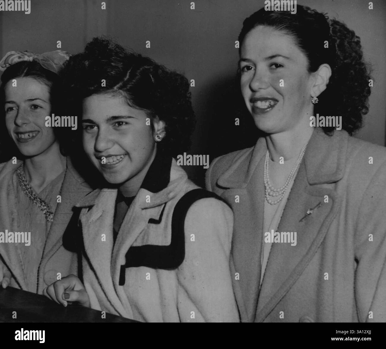 Maltese immigrants girls smile a greeting on arrival in Sydney today on ...