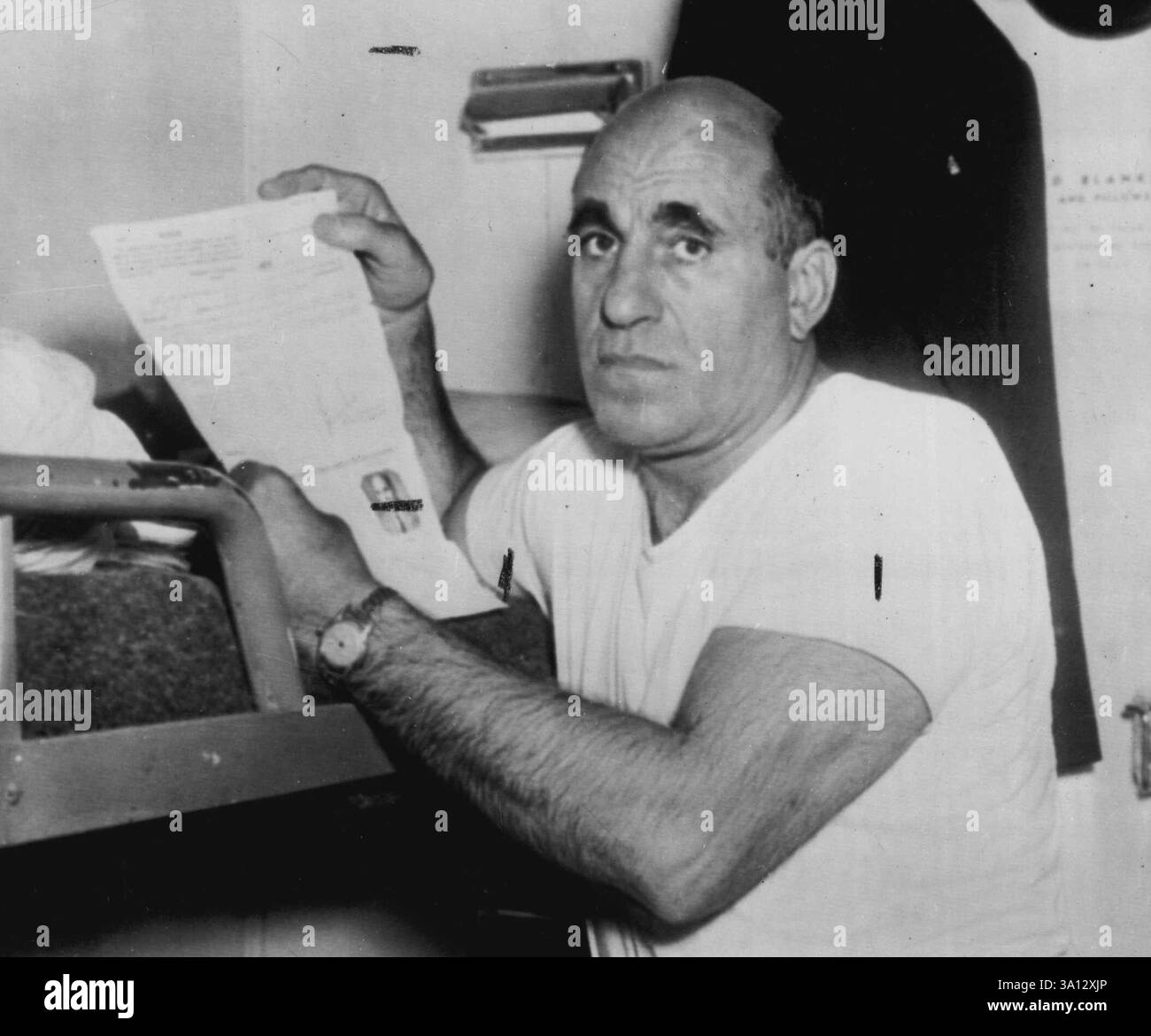 Man Without A Country -- Frank Russo, 44, looks glum in his cabin ...