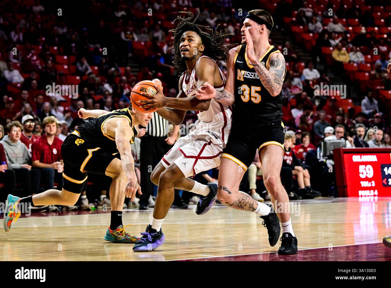 Oklahoma forward Glenn Taylor Jr. (35) drives the ball against Missouri ...