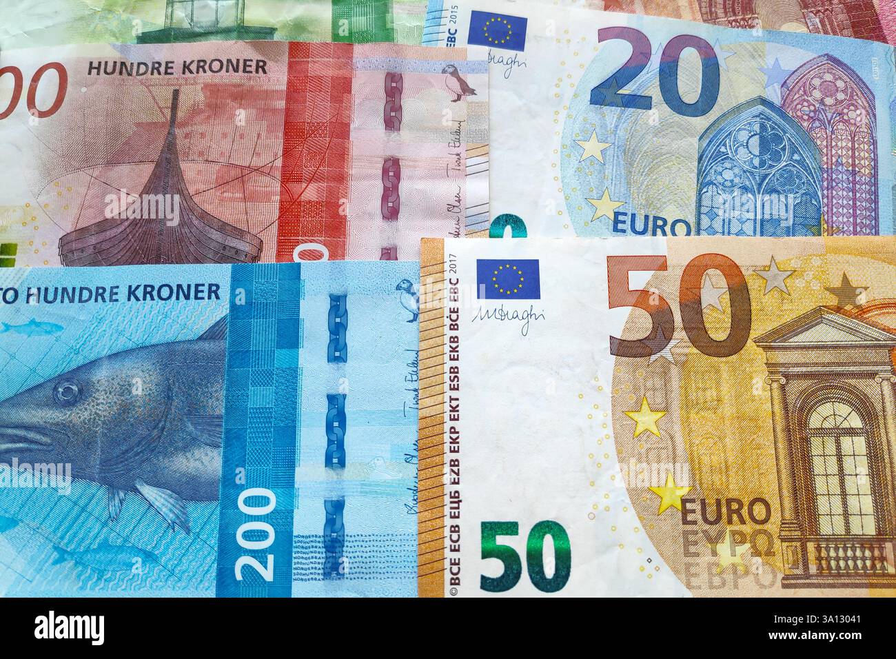 Close-up on a stack of Norwegian krone and Euros Stock Photo - Alamy