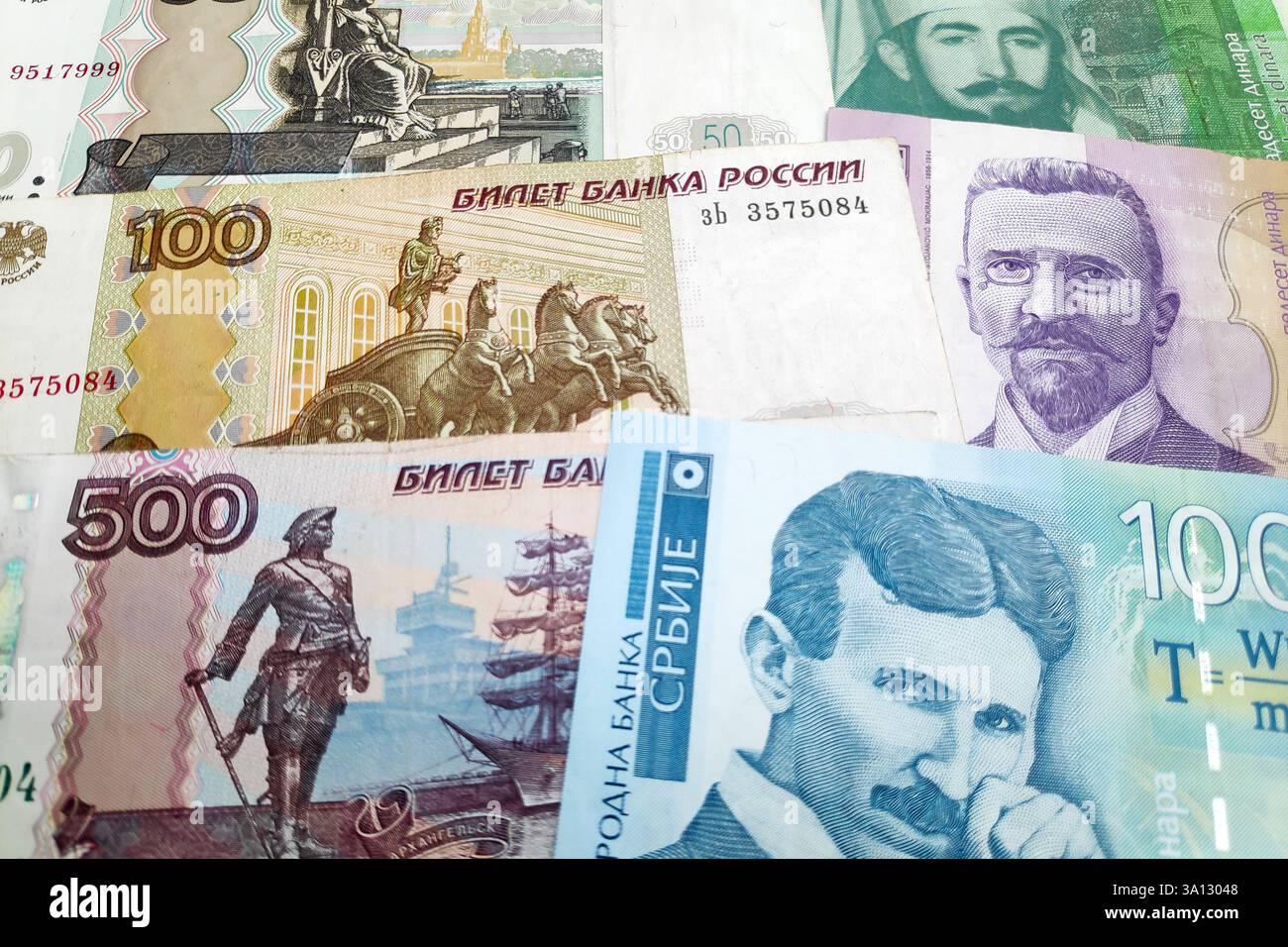 Close-up on a stack of Russian Rubles and Serbian Dinar Stock Photo - Alamy