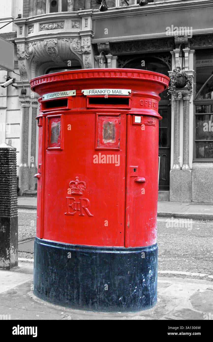 Red double aperture pillar box in Denman Street (London), isolated on a ...
