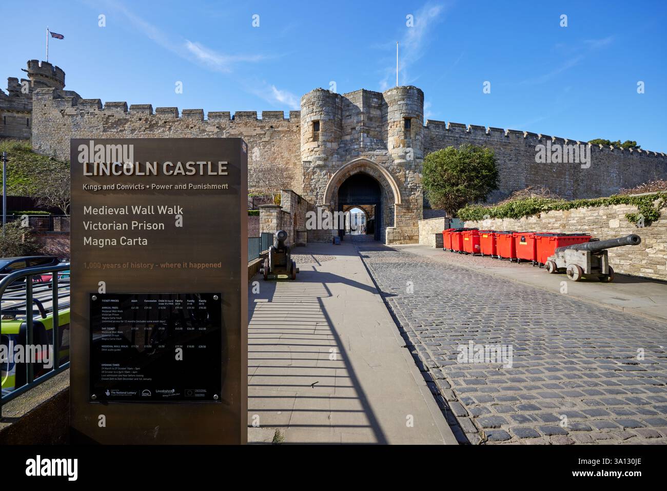 The front gate of Lincoln Castle features a grand medieval stone ...