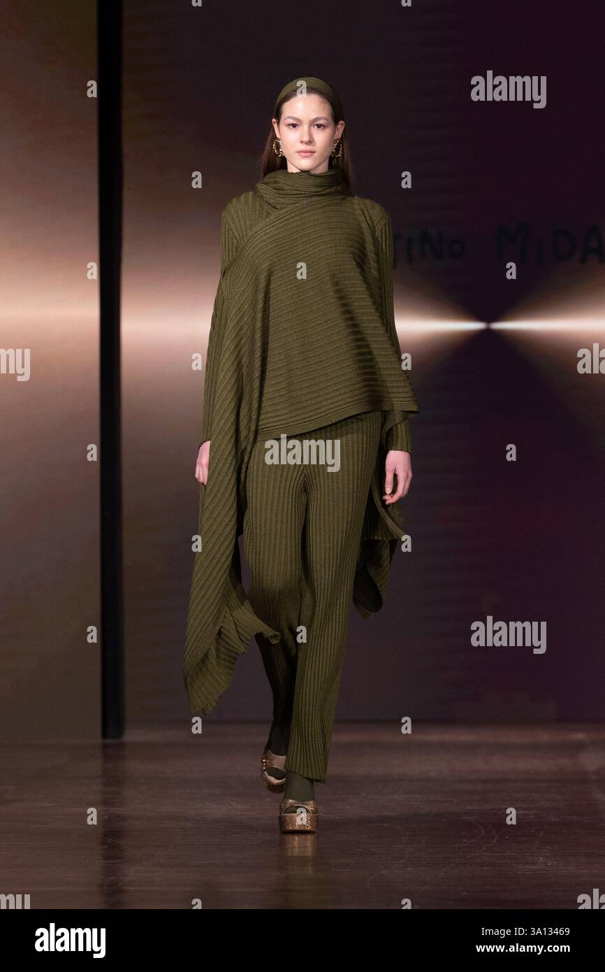 Milan, Italy. 24th Feb, 2025. A model walks the runway during the ...