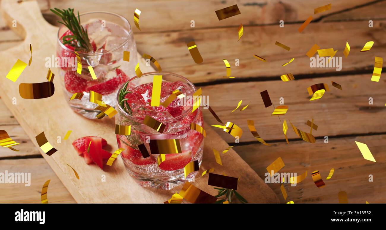 Image of confetti falling over glasses of water with strawberries Stock ...