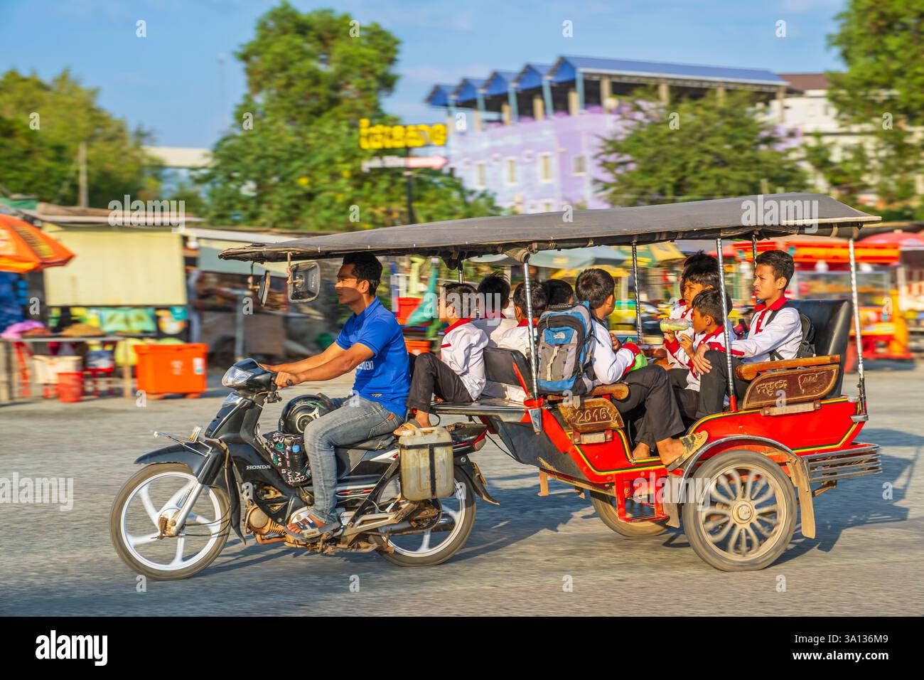 Cambodia, Kampot province, Kampot, school transport by rickshaw Stock Photo - Alamy