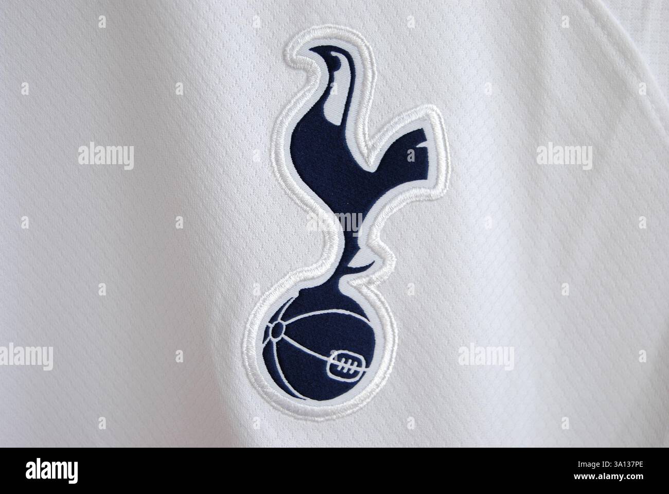 Close up photo of Tottenham Hotspur FC club badge on the home shirt ...