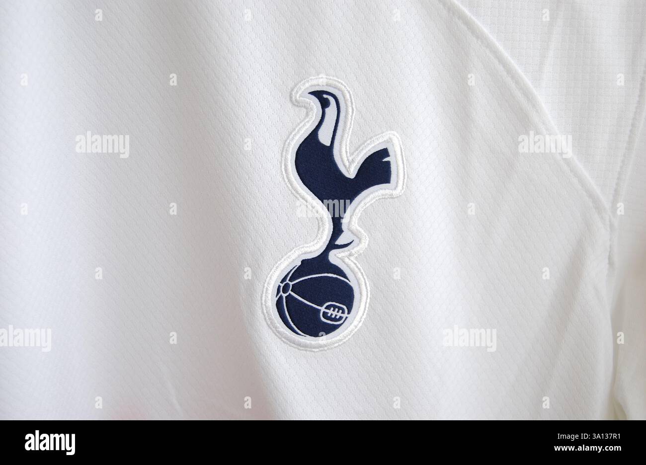 Close up photo of Tottenham Hotspur FC club badge on the home shirt ...