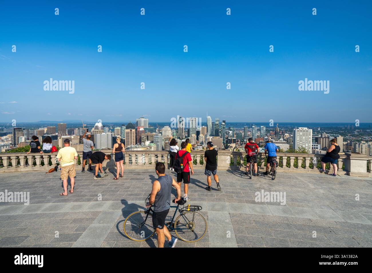People enjoy the breathtaking panoramic view of Montreal's downtown ...