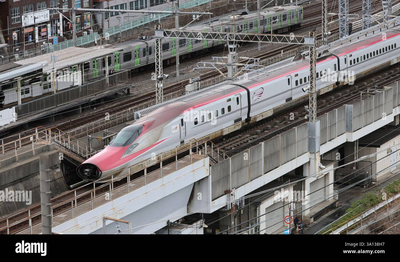 A photo shows "Komachi" of the Tohoku Shinkansen (bullet train) moving with its coupling section ...
