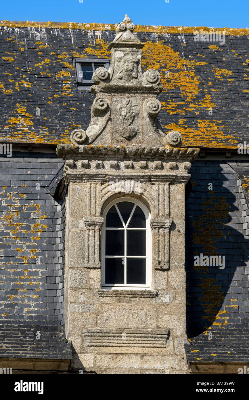 France, Finistère, Roscoff, carved dormer window of an old shipowner's ...