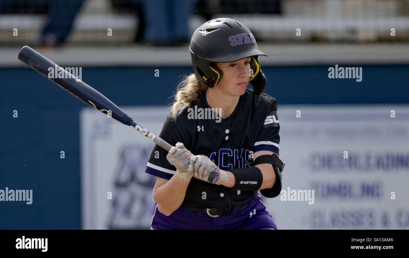 Stephen F. Austin outfielder Mikaelah Burkland (14) bats during an NCAA ...
