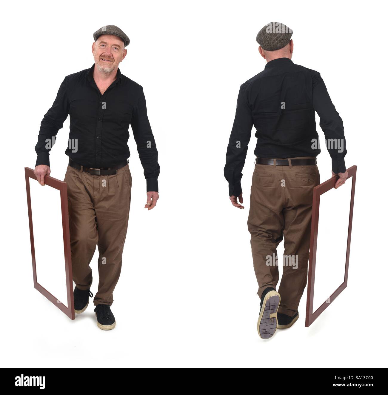 front and rear view of a man walking and carrying a blank frame on ...