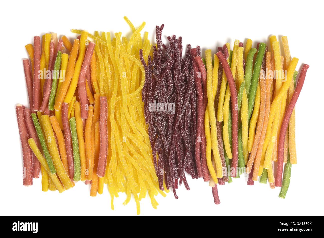 large group of colored licorice with sprinkled sugar on white ...