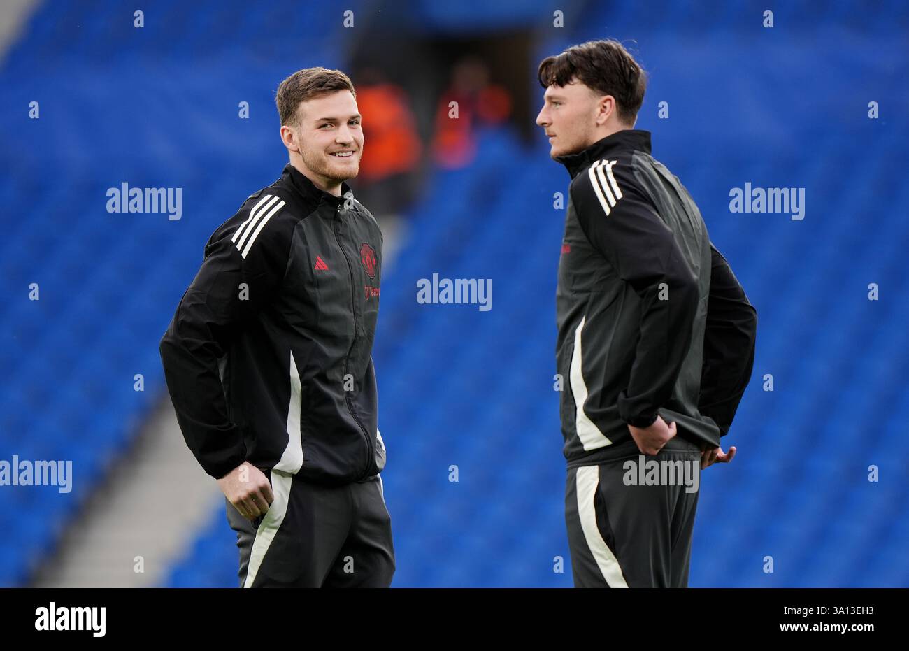 Manchester United goalkeepers Elyh Harrison (right) and Dermot Mee ...