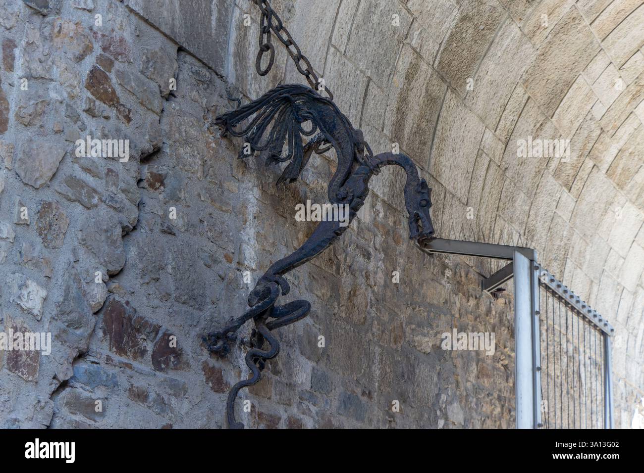 Slovenia. Iron dragon hanging on a wall of the Ljubljana Castle ...