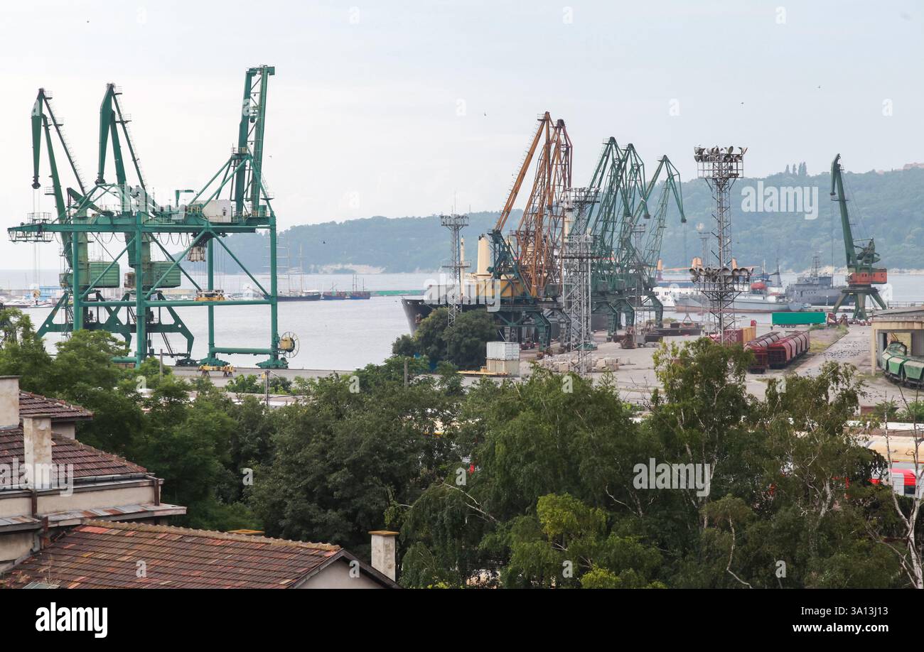 Varna industrial port featuring large cargo cranes, containers, and ...